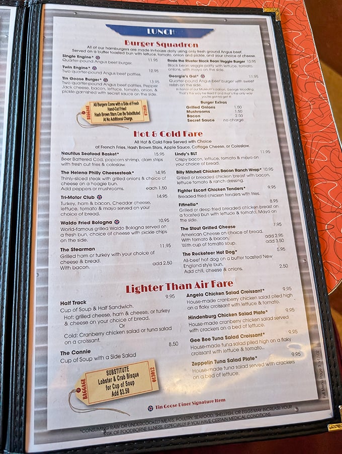 The "Burger Squadron" menu section offers everything from single-engine simplicity to twin-engine indulgence, each crafted with hand-formed Angus beef.