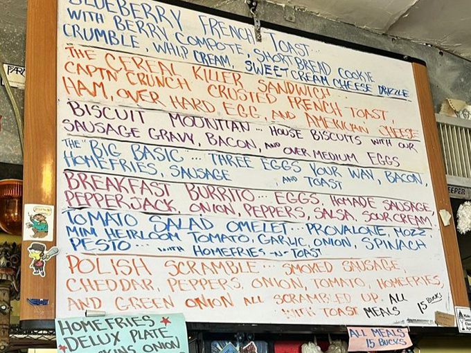 The handwritten menu board – a masterpiece of culinary creativity that changes with the chef's whims and seasonal inspirations.