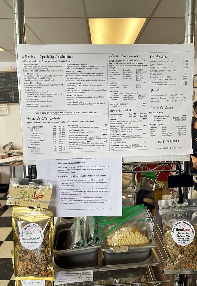 The menu board showcases Marino's impressive array of sandwiches, pasta dishes, and pizzas that have kept locals coming back for decades.