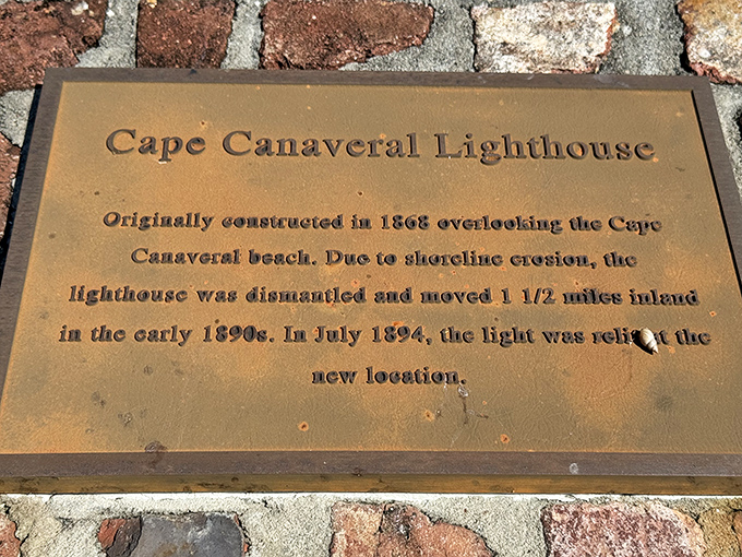 This bronze plaque tells the remarkable story of a lighthouse that refused to surrender to the sea, relocating 1.5 miles inland in the 1890s.