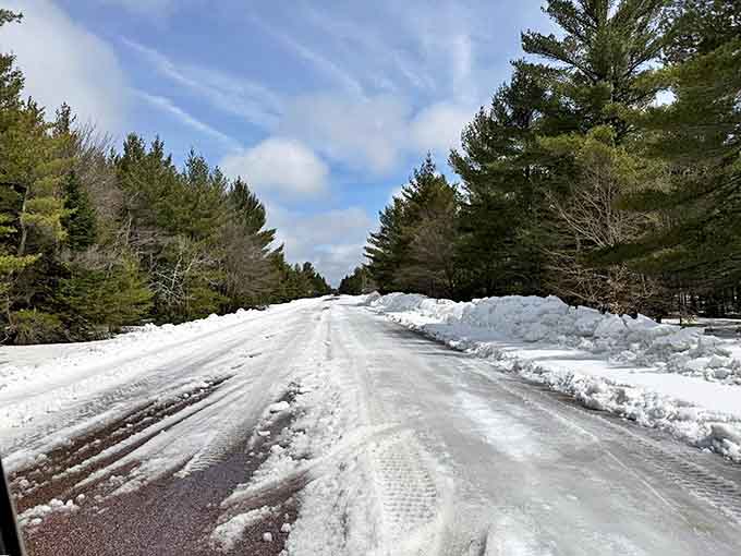 Winter transforms H-58 into a snow-covered wonderland, where tire tracks create parallel stories through a pristine white canvas.