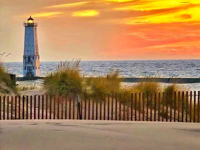 Sunset View: Nature's light show upstages the lighthouse's beam, proving even centenarian structures appreciate a good sunset.
