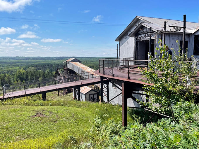 Industrial poetry: The weathered mine buildings stand against Minnesota's sky, silent storytellers of boom times when iron was king.