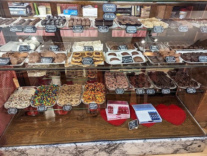 The sweet section showcases an impressive array of handcrafted treats, arranged with the care of a confectionery museum curator.