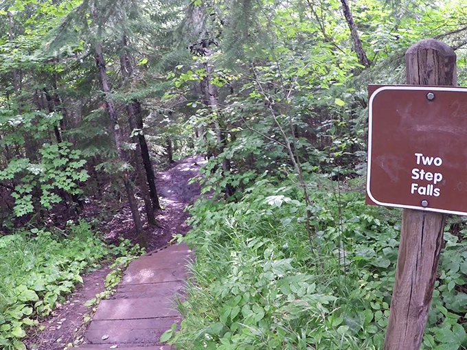 The trail sign stands like a humble ma&icirc;tre d', ready to escort you to the main attraction that's been millions of years in the making.