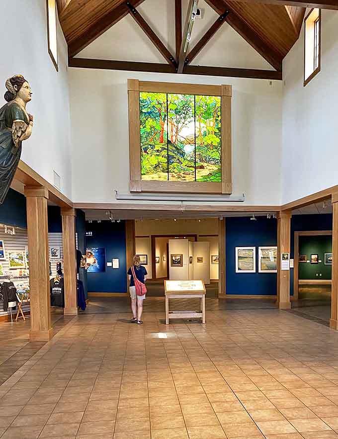 Upon entering: A breathtaking stained glass installation bathes visitors in emerald light, while soaring wooden beams create the sensation of standing beneath a ship's hull.