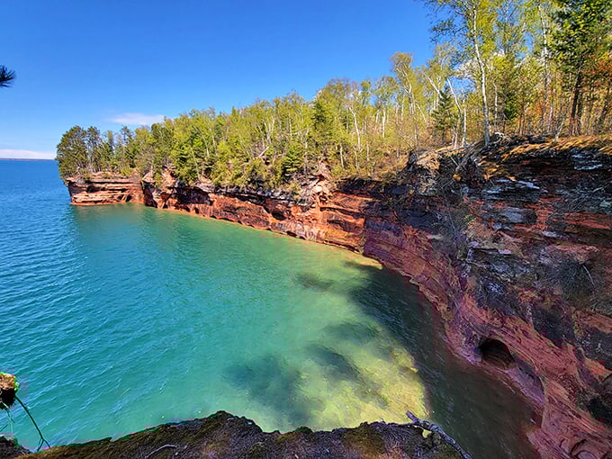 Billion-year-old sandstone cliffs glow with warm amber hues against Lake Superior's impossibly blue waters &ndash; no filter needed here.