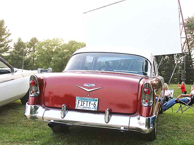 Classic American automotive history on display &ndash; this cherry-red Chevy isn't just transportation, it's a time machine with whitewalls.