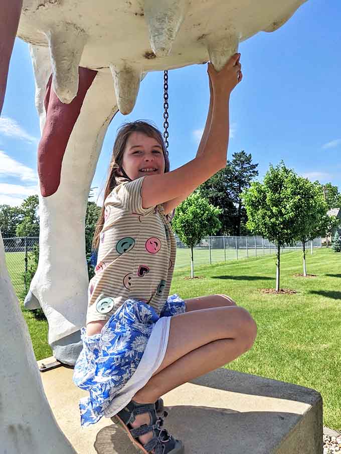 The joy of discovery! A young visitor demonstrates the interactive nature of this beloved bovine attraction.