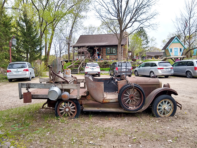 Time stands still at Hot Sam's, where this vintage car has been reimagined as a rustic sculpture, nature slowly reclaiming what man abandoned.