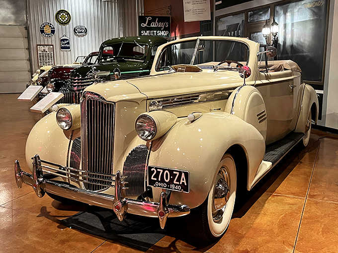 This cream-colored 1940 Packard Super Eight convertible isn't just a car—it's automotive royalty that makes you understand why people dressed up for Sunday drives.