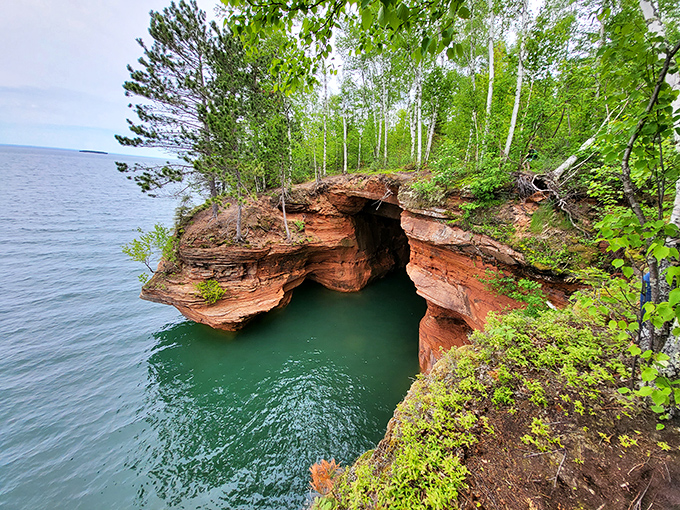 Nature's masterpiece: the Apostle Islands sea caves where water has sculpted sandstone into cathedral-like chambers waiting for kayakers to discover.