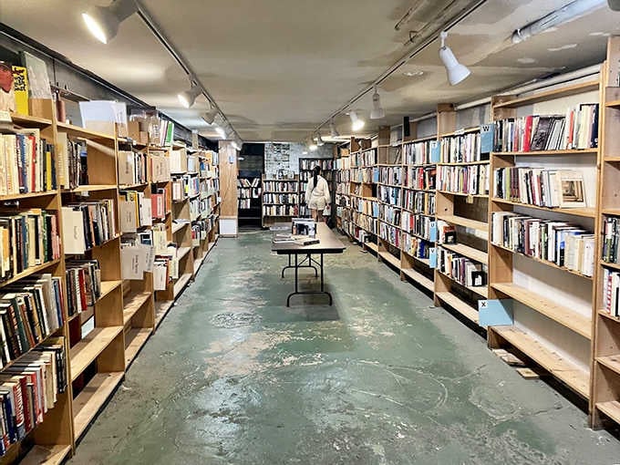 Exposed pipes and concrete floors give the basement a secret bunker feel &ndash; as if these books survived some literary apocalypse.