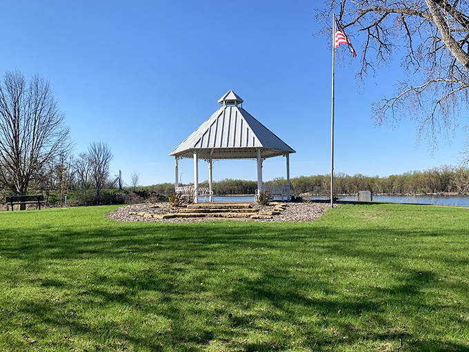 A pristine white gazebo stands sentinel by the Mississippi, offering shelter and spectacular river views that have inspired generations of Wabasha dreamers.