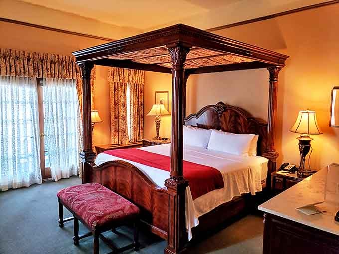 A four-poster bed draped in luxury linens promises dreams sweeter than any dessert, with a fireplace ready to set the perfect mood.