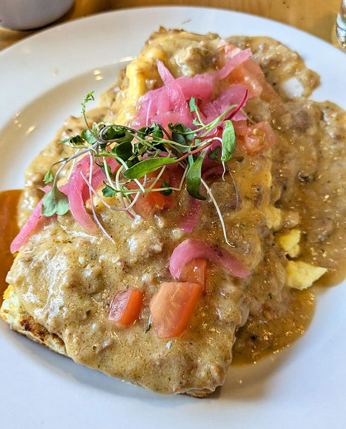 These aren't ordinary biscuits and gravy &ndash; they're cloud-like pillows of buttery perfection crowned with microgreens and pickled onions for a modern twist.