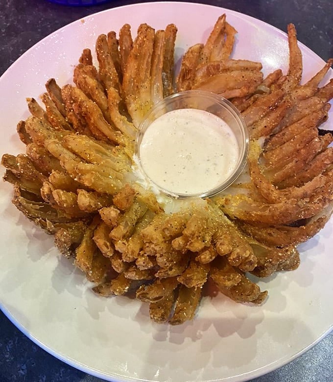 This golden-brown beauty arrives like an exotic deep-sea creature &ndash; crispy petals radiating outward, begging to be dunked in tangy sauce.