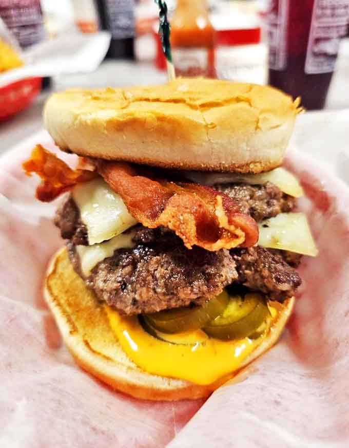 The Boom Boom Burger lives up to its explosive name &ndash; stacked high with bacon, cheese, and all the fixings that make taste buds dance.