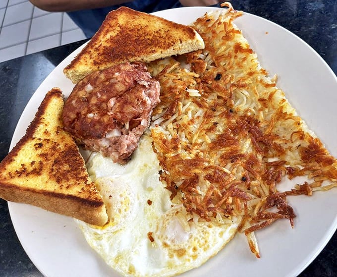 Breakfast perfection on a plate: golden hash browns, perfectly cooked eggs, and toast that didn't forget its butter. Morning glory, indeed!