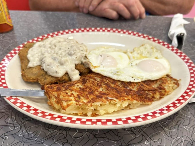 Country-fried steak smothered in gravy alongside golden hash browns and sunny eggs &ndash; a breakfast trinity that demands reverence.