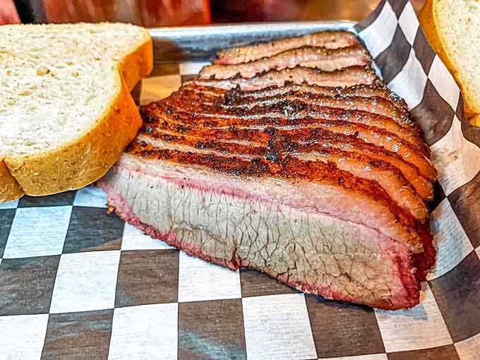 Brisket so tender it surrenders at the mere suggestion of a fork, sporting that coveted pink smoke ring.