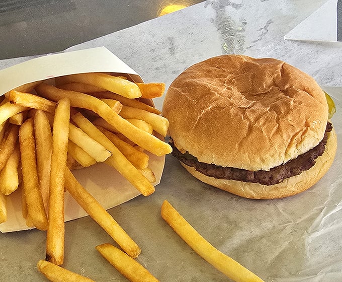 The classic burger and fries combo at Lou's – proof that perfection doesn't need reinvention, just quality ingredients and decades of know-how.