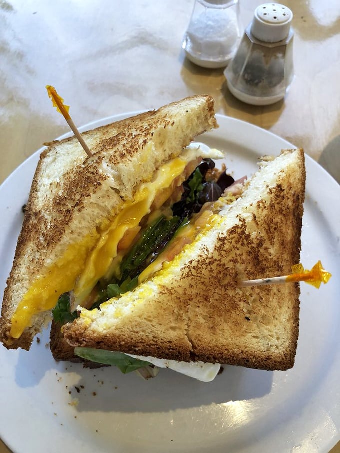 The California Egg Sandwich – where perfectly cooked eggs meet fresh greens in a handheld masterpiece that might actually make you forget your name mid-bite.