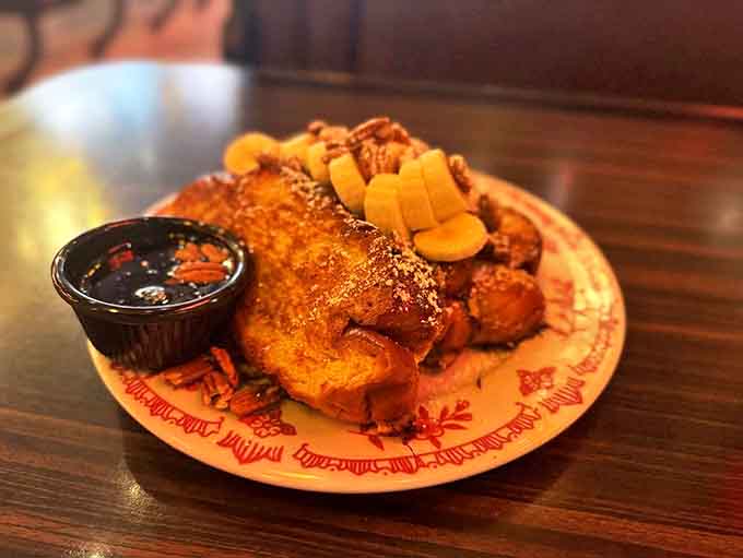This Challah French toast isn't just breakfast, it's an event &ndash; golden-crisp exterior giving way to custardy perfection, topped with bananas and nuts.