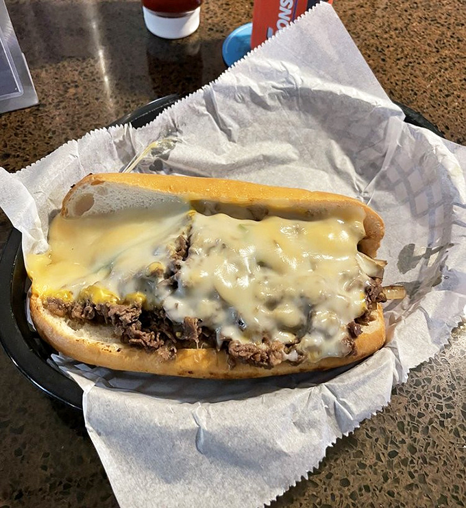 This traditional cheesesteak doesn't need fancy tricks, just perfectly seasoned ribeye and melted cheese creating sandwich harmony on an Amoroso roll.