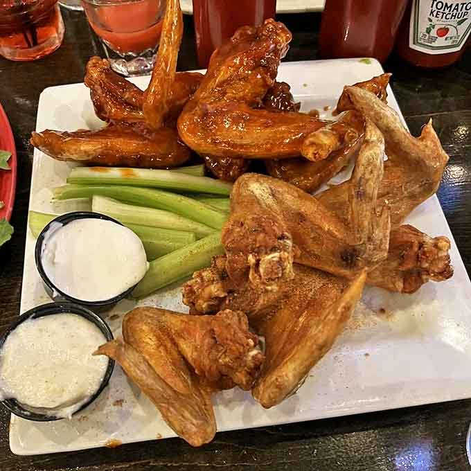 Golden-brown perfection: These wings achieve that mythical balance of crispy exterior and juicy interior that wing aficionados dream about.