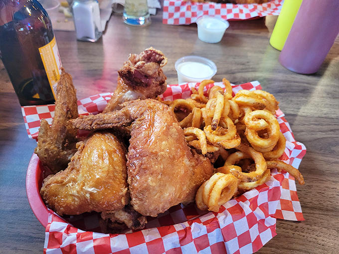 Golden-fried jumbo wings with curly fries, a combination that's worth the drive to Chippewa Falls all by itself.