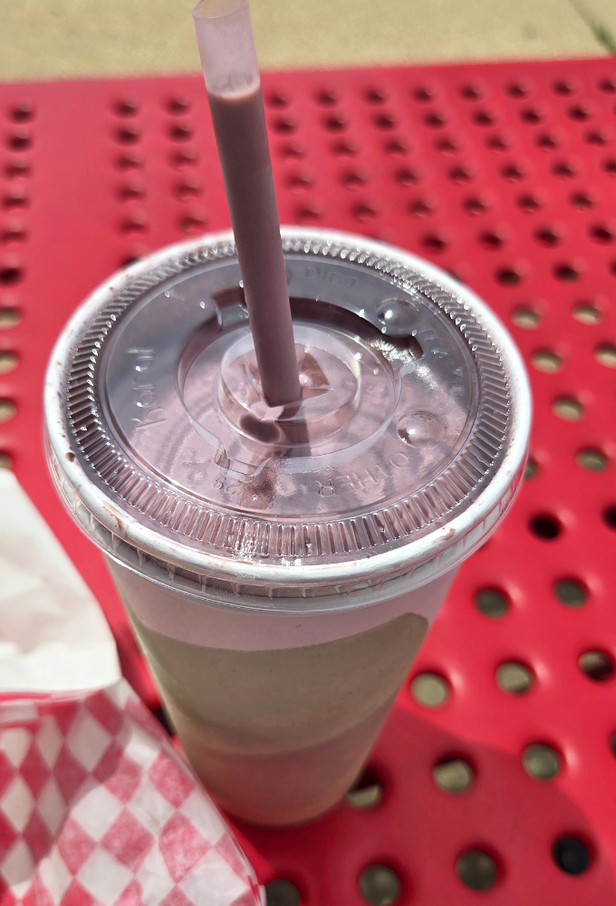 This chocolate shake isn't just a drink, it's a creamy time machine that transports you back to simpler days with every sip.