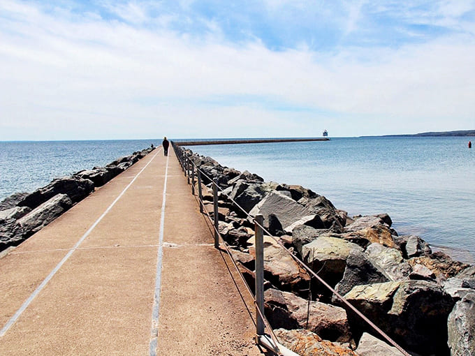Walking this path feels like stepping into a postcard &ndash; solid concrete beneath your feet, Lake Superior's moods surrounding you on both sides.