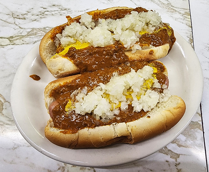 The legendary Detroit Coney dog in all its glory &ndash; beef chili, mustard, and onions creating a holy trinity of flavor that's worth the pilgrimage.
