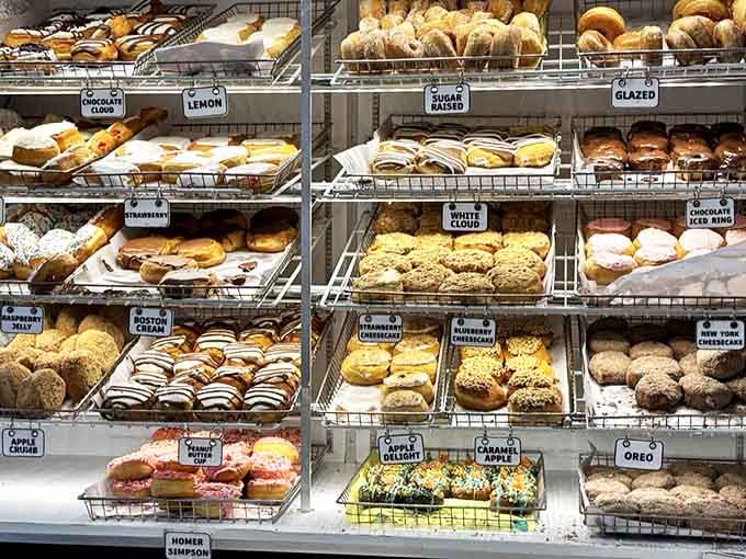 A treasure trove of fried perfection &ndash; each shelf showcases donuts that aren't just breakfast, they're life-affirming experiences in circular form.