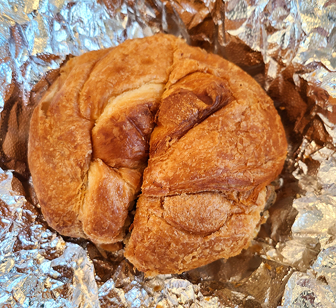 This isn't just a croissant&mdash;it's a buttery miracle of flaky layers that shatters just right, leaving evidence of excellence with every bite.