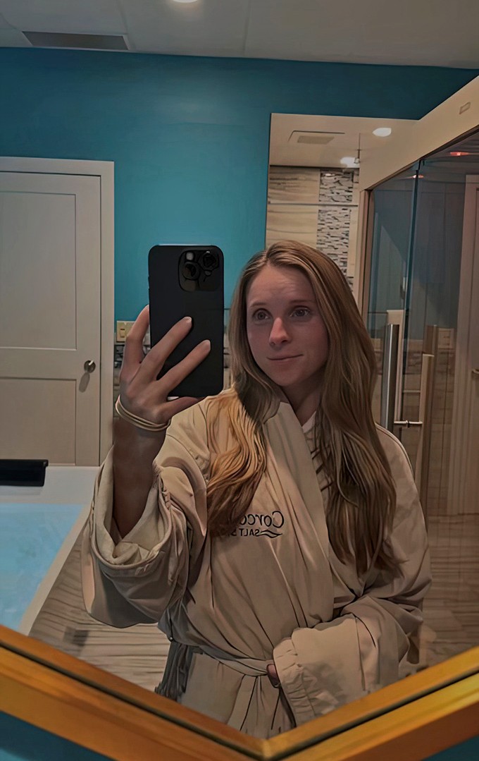 A visitor prepares for their salt therapy session, wrapped in the spa's signature plush robe.