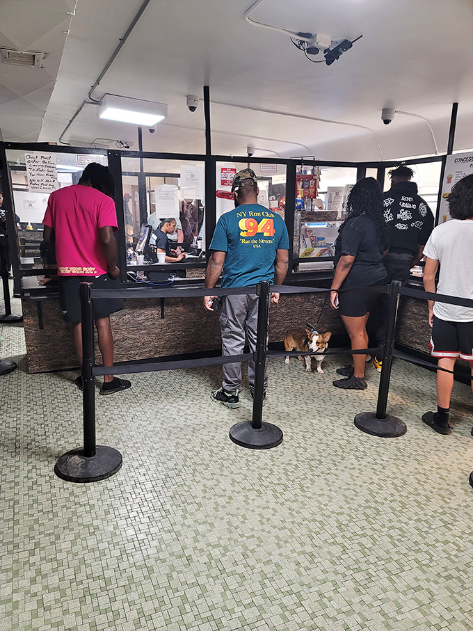 Patrons line up at the concession stand, where movie theater treats taste somehow better than anywhere else.
