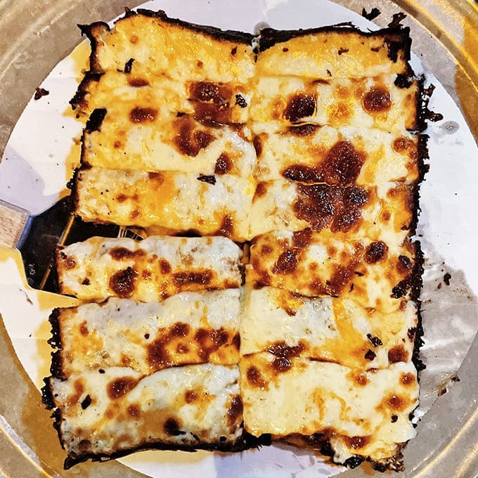 Crispy-edged perfection with that signature caramelized cheese crust&mdash;simple yet transcendent, the way comfort food should be.