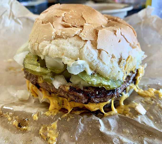 Behold the Double Cheeseburger in all its glory! Charcoal-kissed beef, melty cheese, and that signature butter treatment create edible poetry.