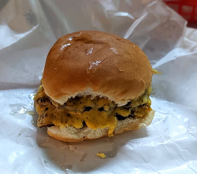 Behold the legendary Jucy Lucy in all its glory, cheese oozing from within its perfectly grilled beef patties.