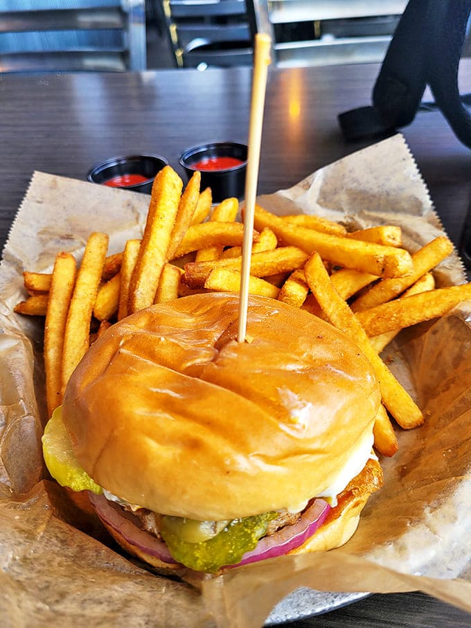 A perfect burger-to-fry ratio that satisfies the golden rule of handheld dining. That pickle peeking out is practically winking at you!