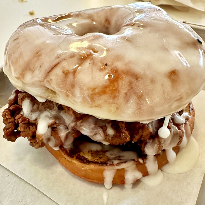 Breakfast rebellion: a glazed donut embracing crispy fried chicken in a savory-sweet marriage that makes traditional breakfast sandwiches jealous.