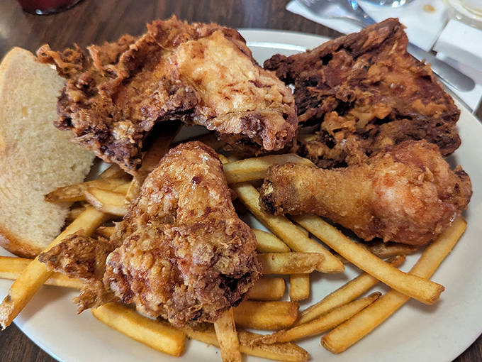 Golden-brown fried chicken that shatters with each bite, revealing juicy meat beneath &ndash; worth every single calorie and then some.