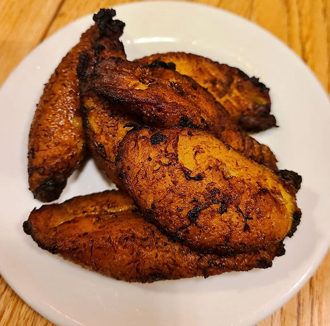 Golden-brown plantains with caramelized edges that shatter like candy, revealing a tender sweetness that's utterly addictive.