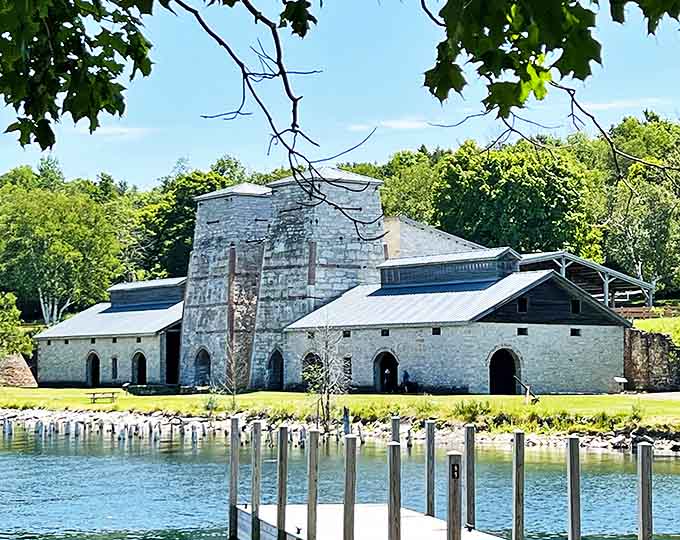The imposing furnace complex rises like a medieval castle, its massive stone walls having witnessed the fiery birth of American industry.