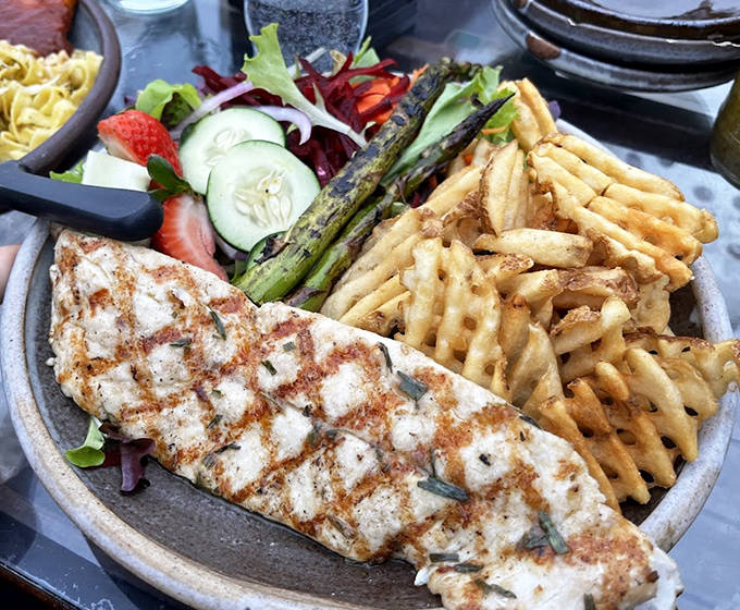 Perfectly grilled whitefish, flaky and moist, served with seasonal vegetables and crispy fries &ndash; simplicity elevated to an art form.