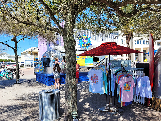 Gyro Hero stands ready for lunchtime warriors, its blue signage and silver exterior promising Mediterranean flavors just steps from the beach.