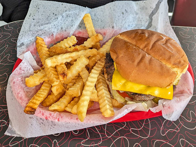 "The Carl" &ndash; half a pound of hand-formed beef perfection nestled in a soft bun with crinkle-cut fries that deserve their own fan club.