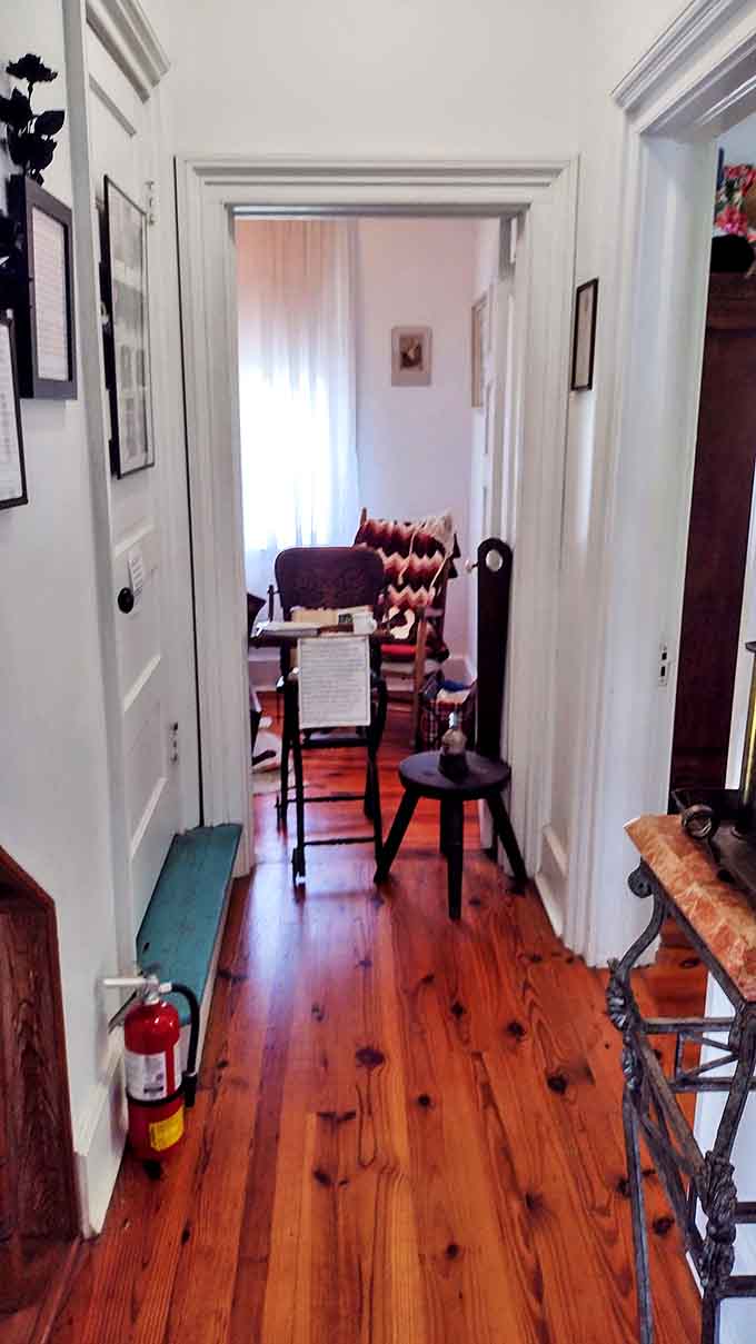 Polished hardwood floors lead down hallways where unexplained footsteps have been reported for decades.